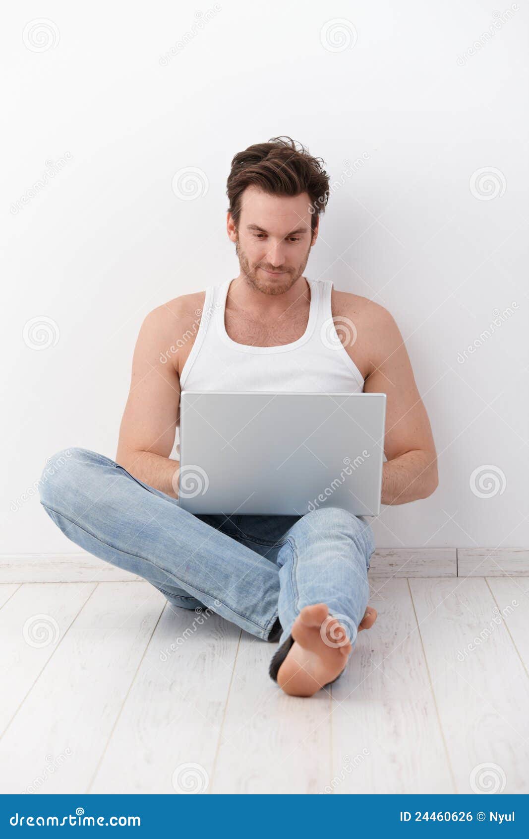 Young Man Using Laptop on Floor Smiling Stock Photo - Image of laptop ...