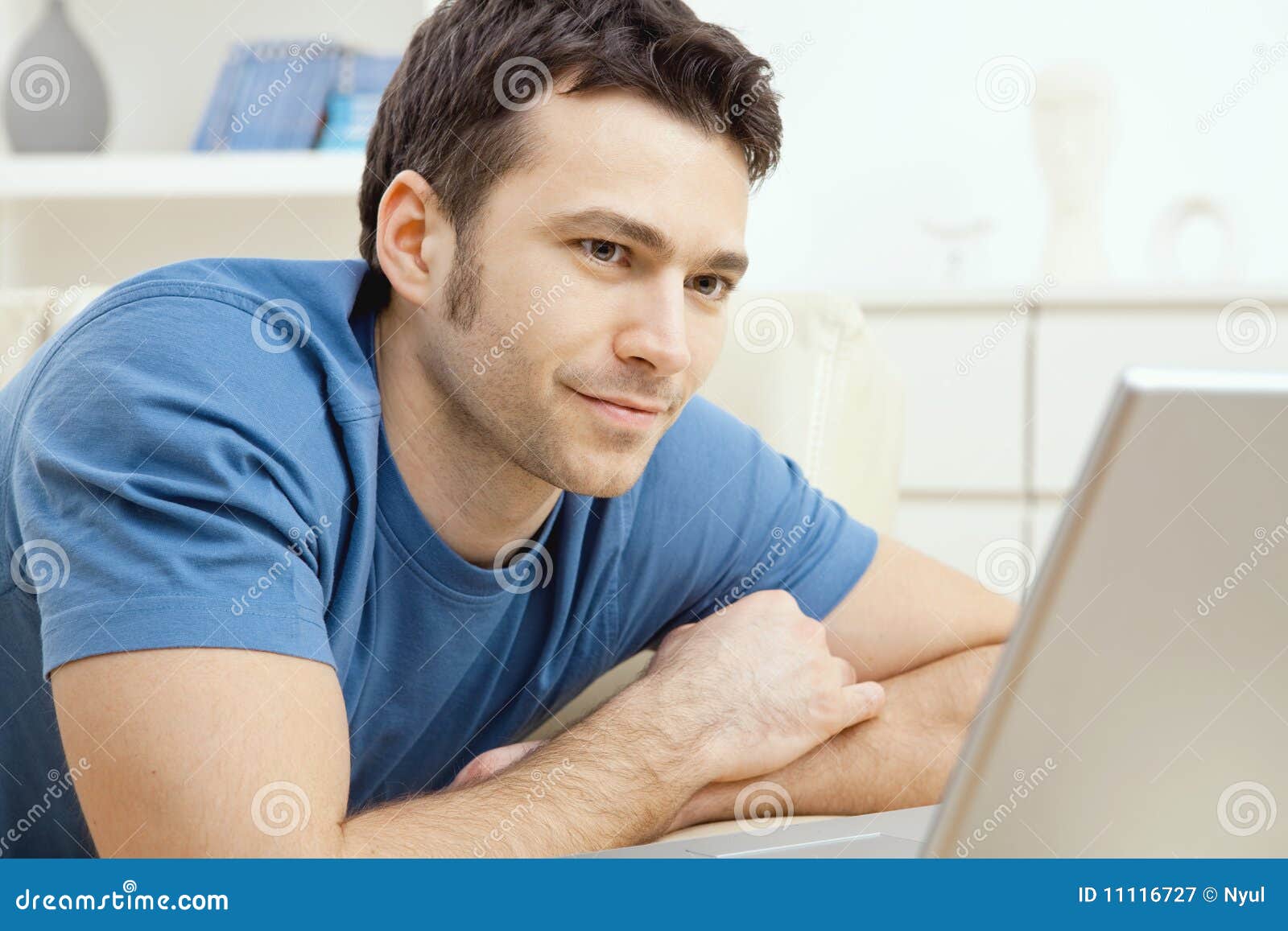 Young Man Using Laptop at Home Stock Image - Image of comfort, chatting ...