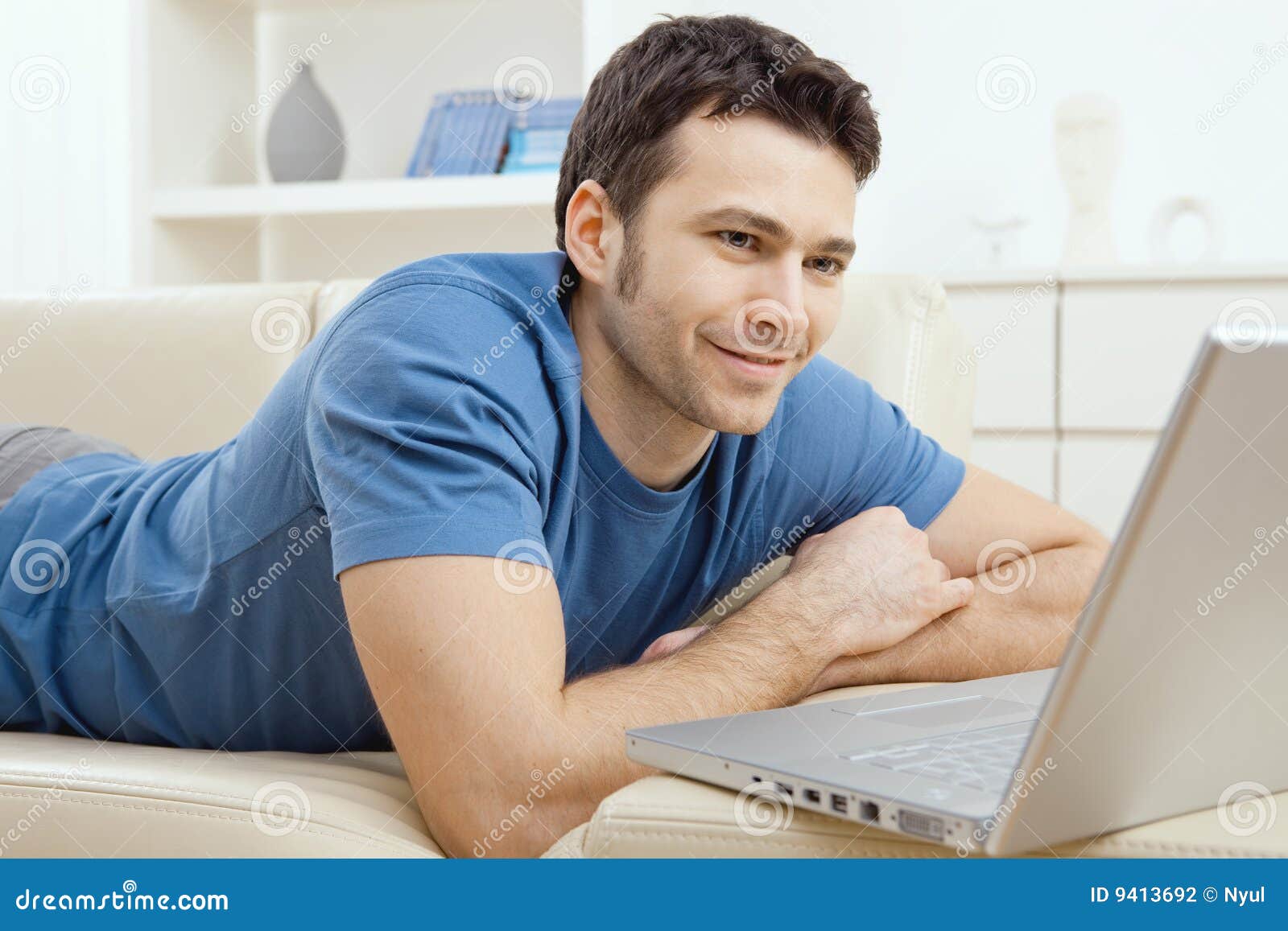 Young Man Using Laptop at Home Stock Photo - Image of connectivity ...
