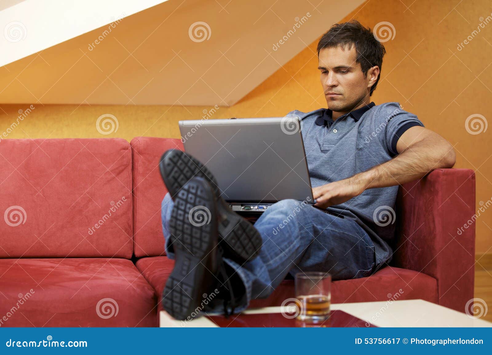 Young man using laptop stock image. Image of adult, full - 53756617