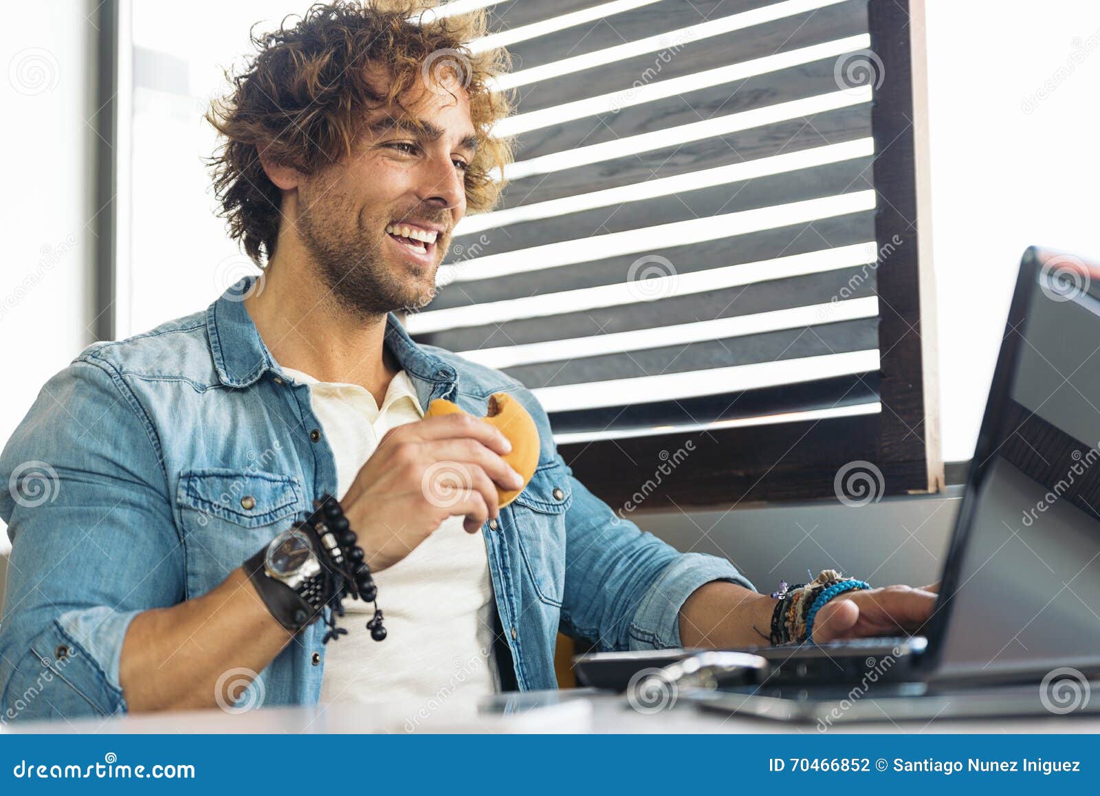 Young Man Using Laptop while To Have Lunch. Stock Photo - Image of ...