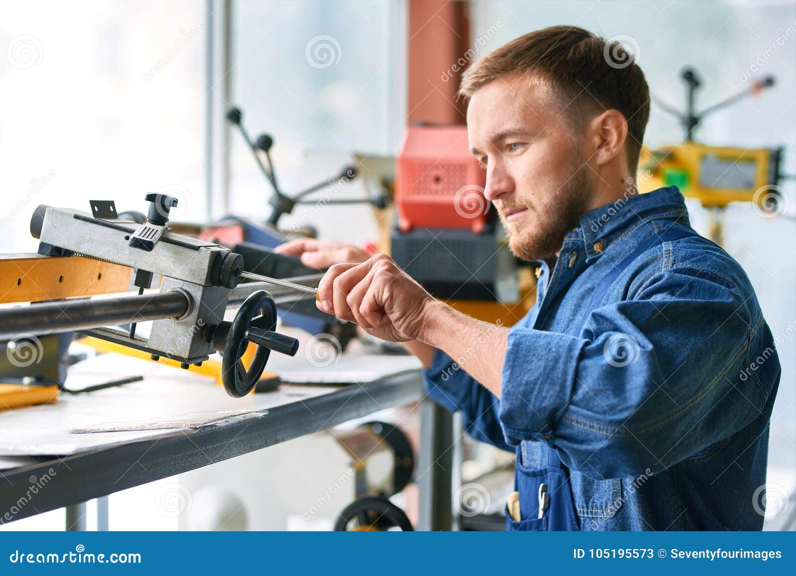 Young Man Using Machine Units at Factory Stock Image - Image of unit ...