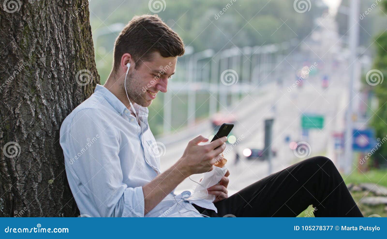 A Young Man Using a Mobile Outdoors Stock Image - Image of adult ...