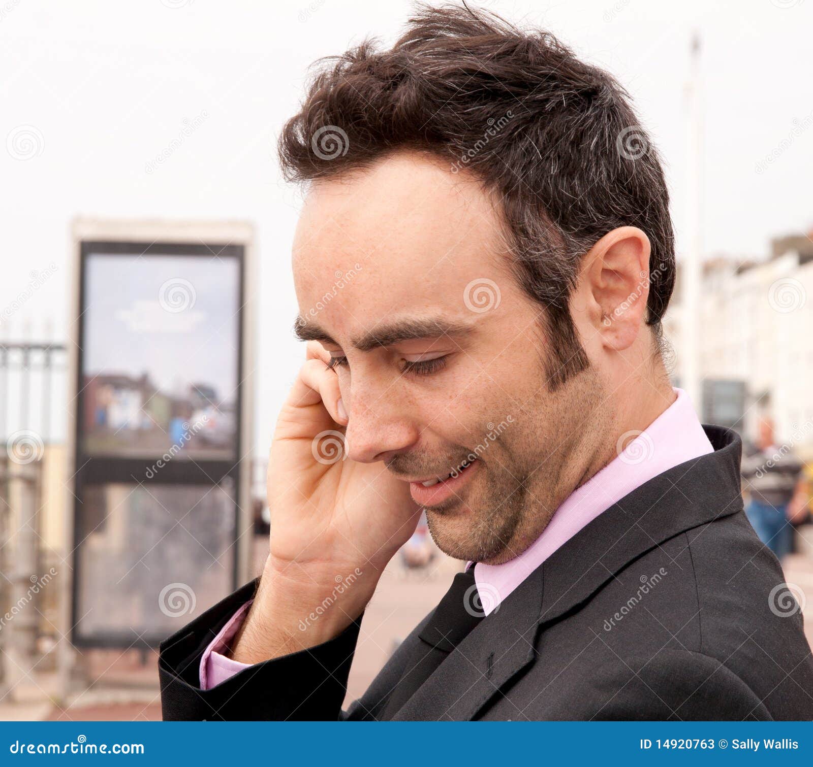 Young Man Using Mobile beside Phone Box Stock Image - Image of young ...