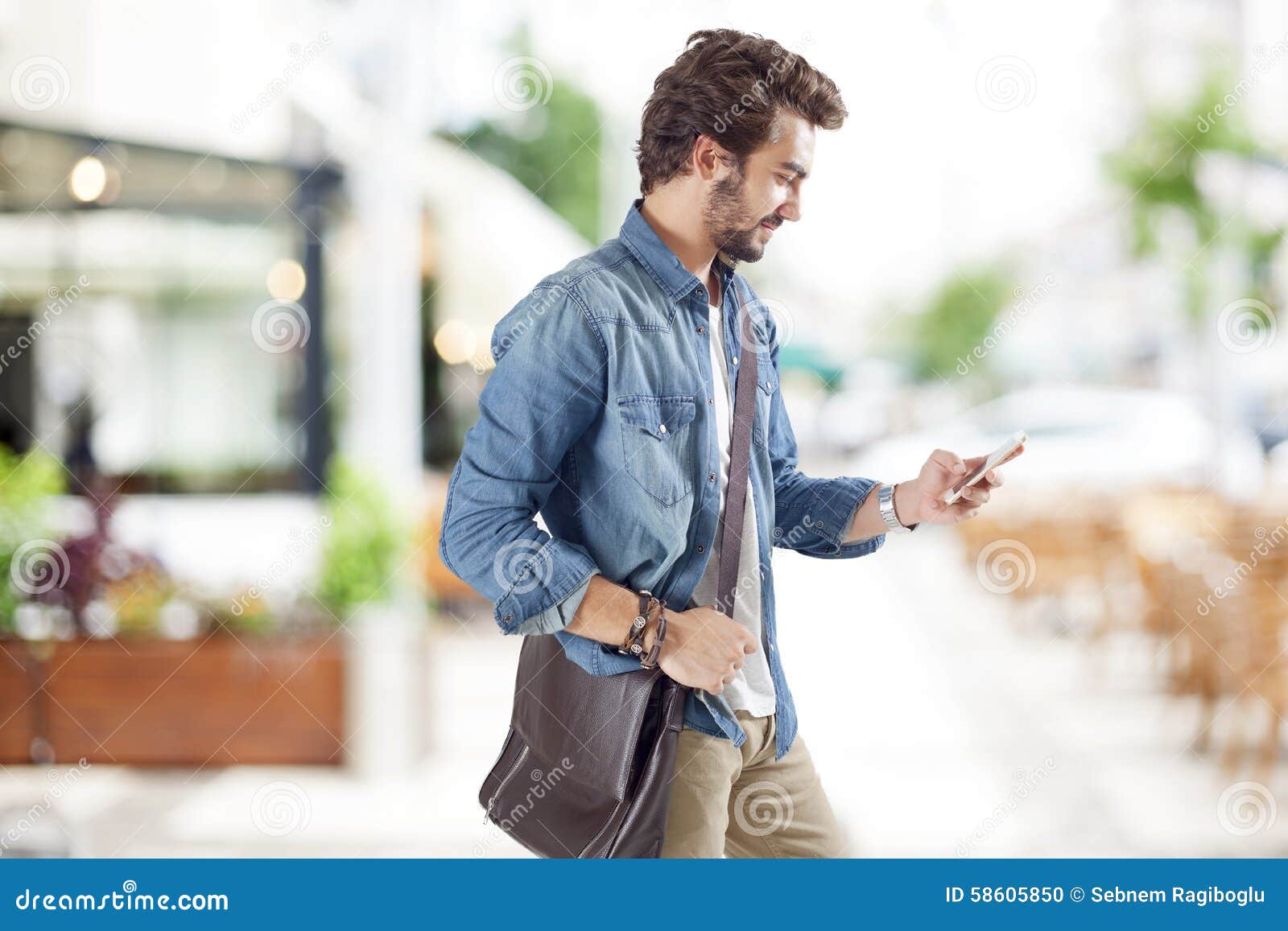 Young Man Using Mobile Phone in Street Stock Photo - Image of happy ...