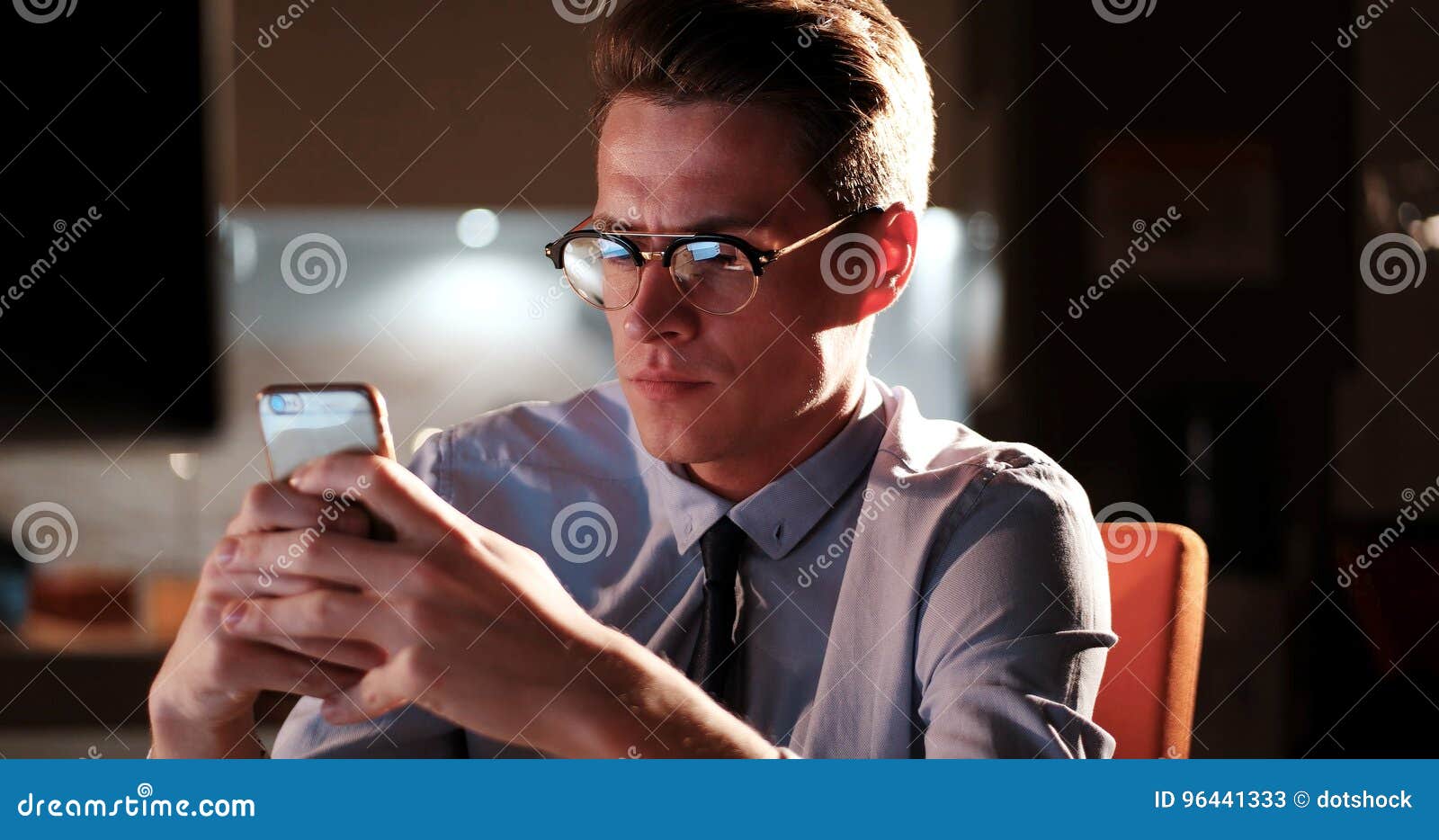 Man Using Mobile Phone in Dark Office Stock Image - Image of mobile ...