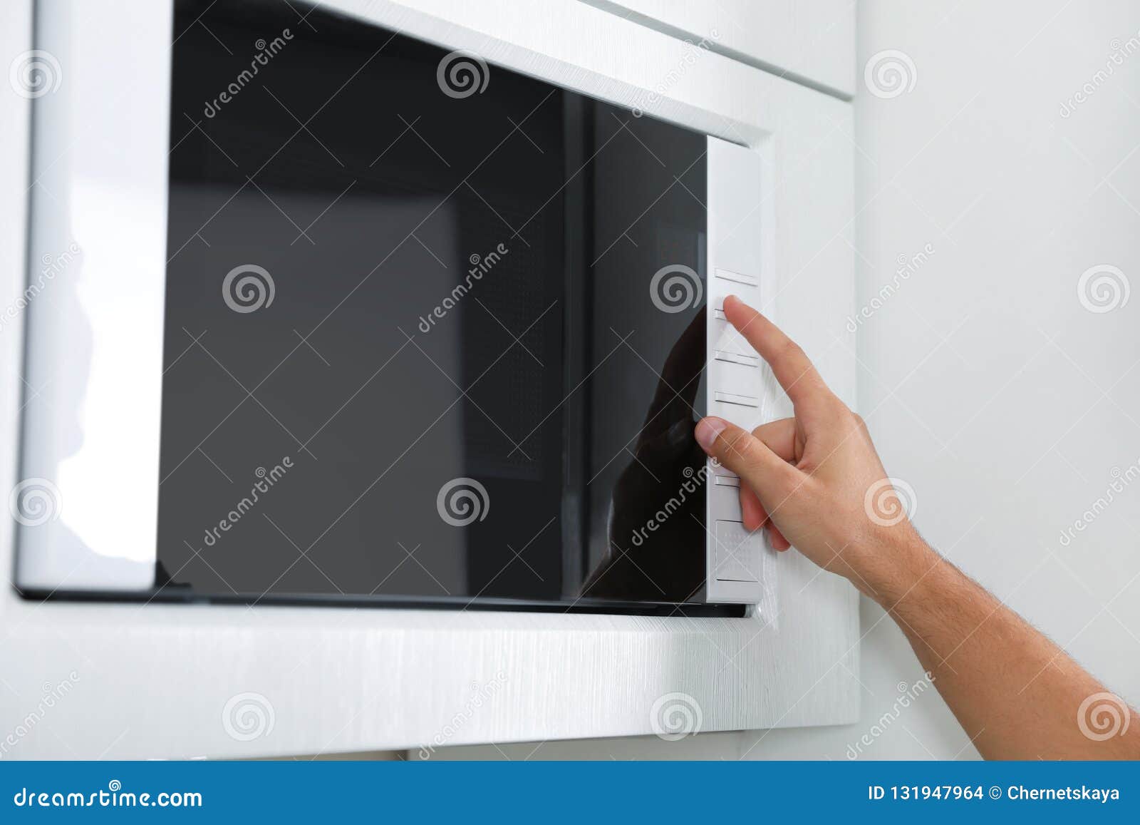 Young Man Using Modern Microwave Oven Stock Photo - Image of appliance ...