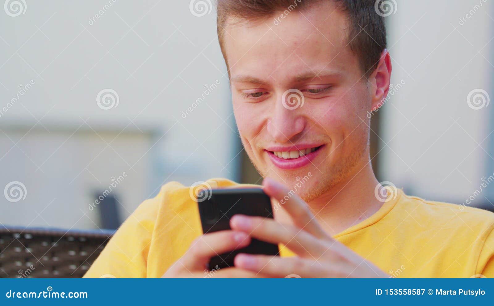 Man Using a Phone Indoors stock image. Image of internet - 153558587