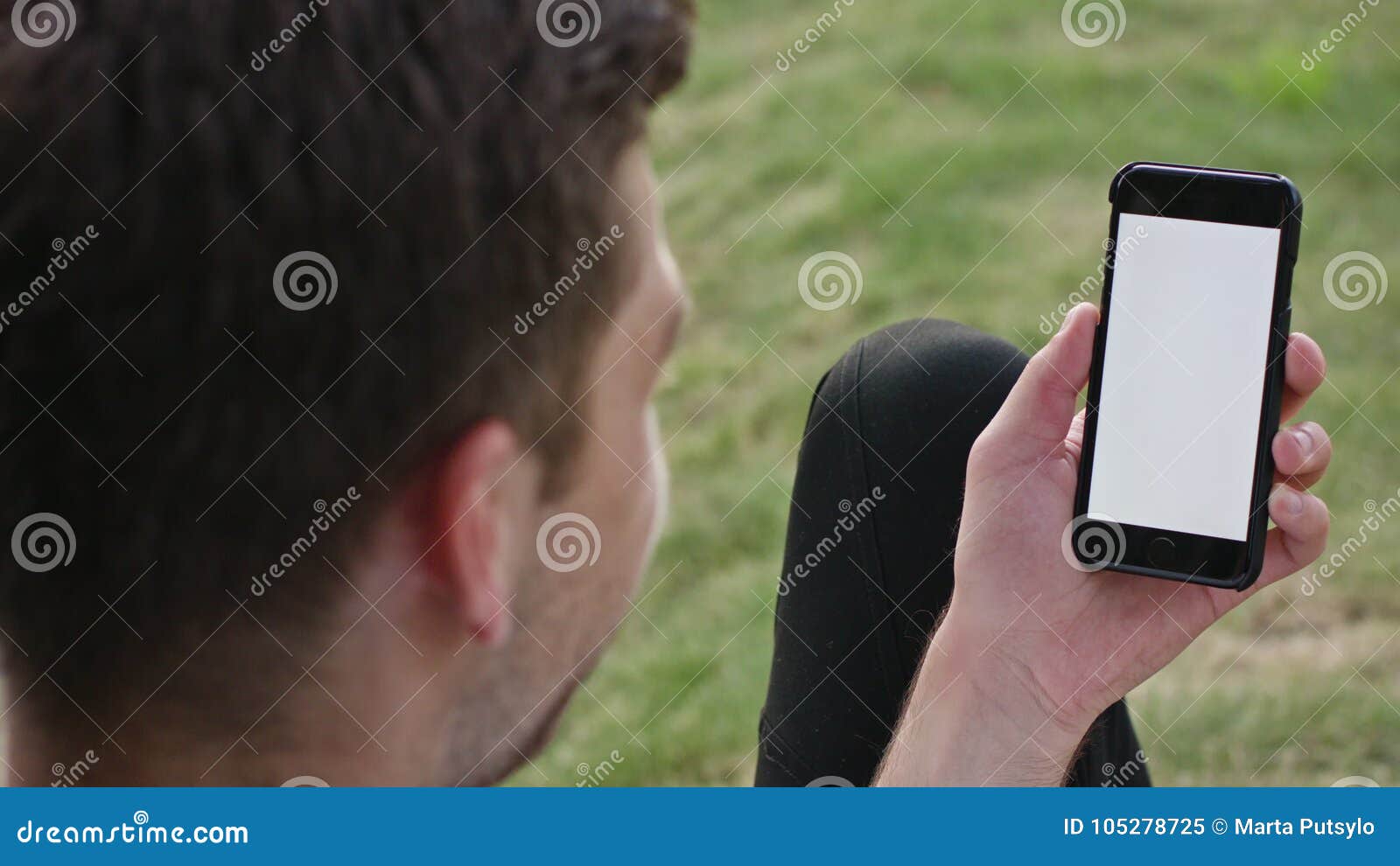 A Young Man Using a Phone Outdoors Stock Image - Image of leisure ...