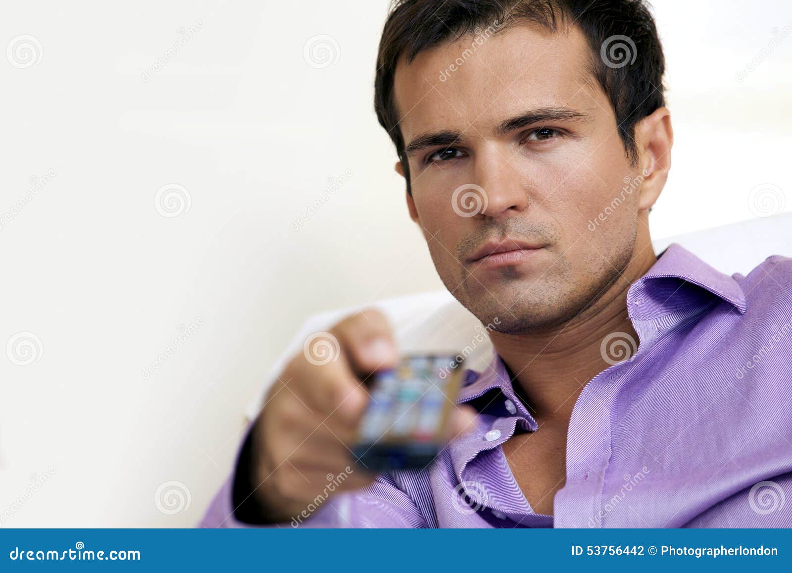 Young Man Using Remote Control Stock Photo - Image of caucasian ...