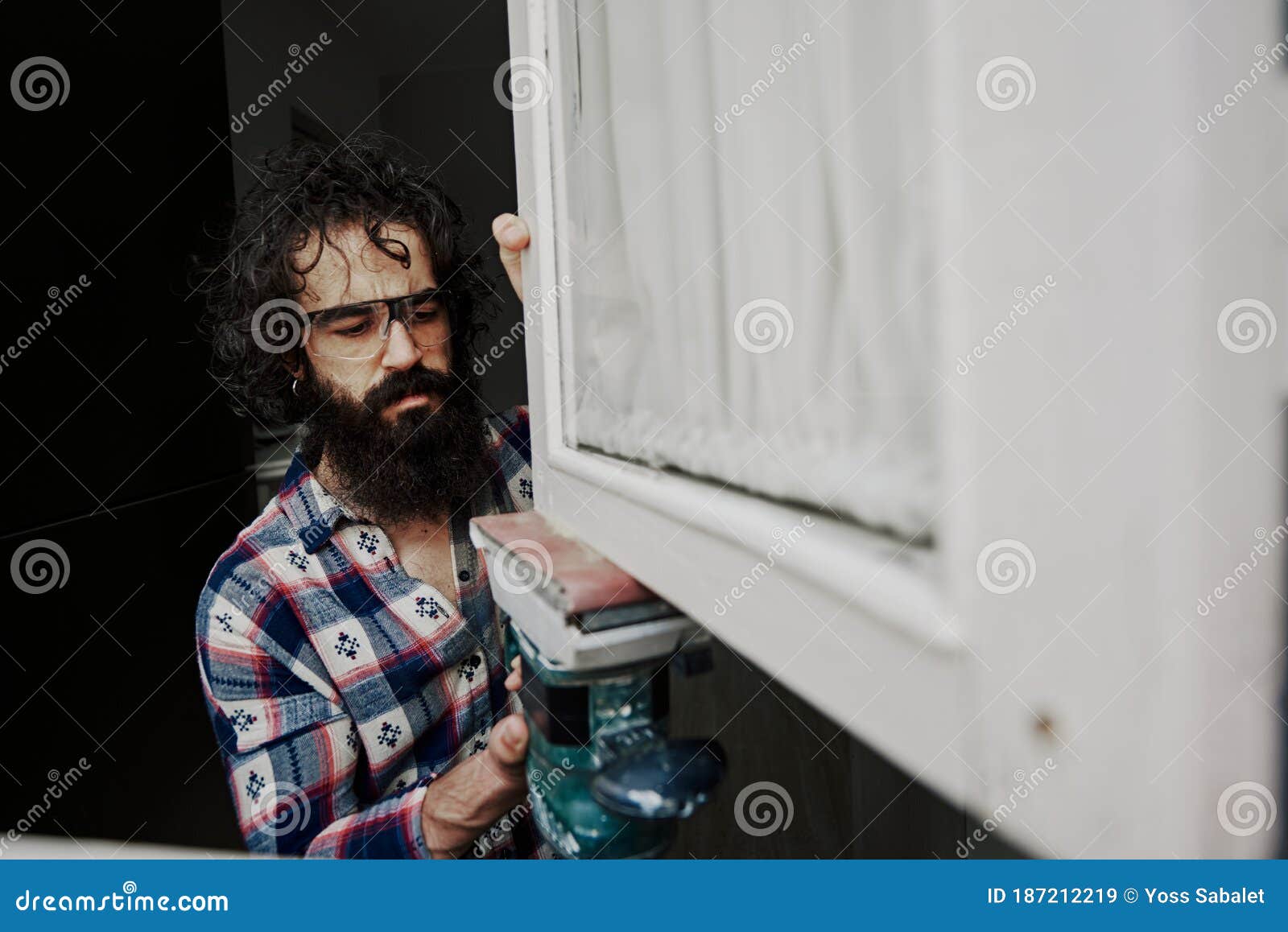 A young men using a sander stock image. Image of male - 187212219
