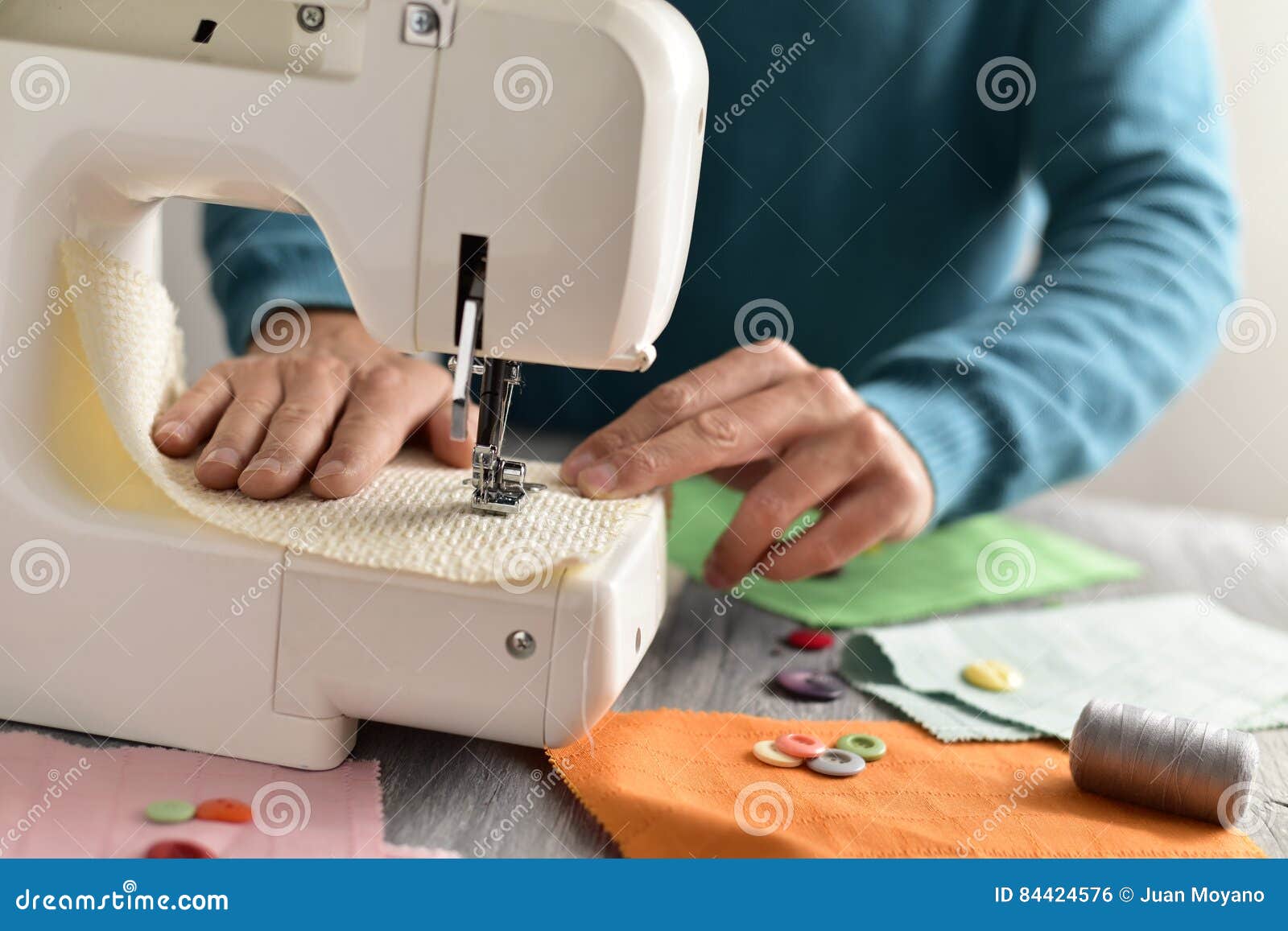 Young Man Using a Sewing Machine Stock Photo - Image of profession ...
