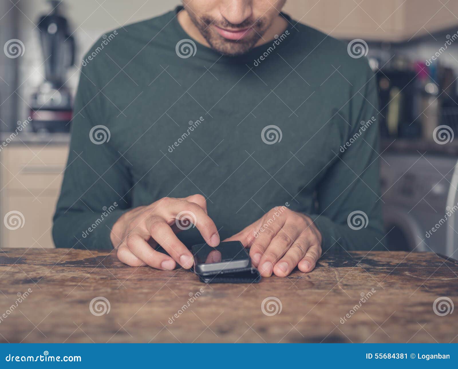 Young Man Using Smart Phone in Kitchen Stock Image - Image of people ...