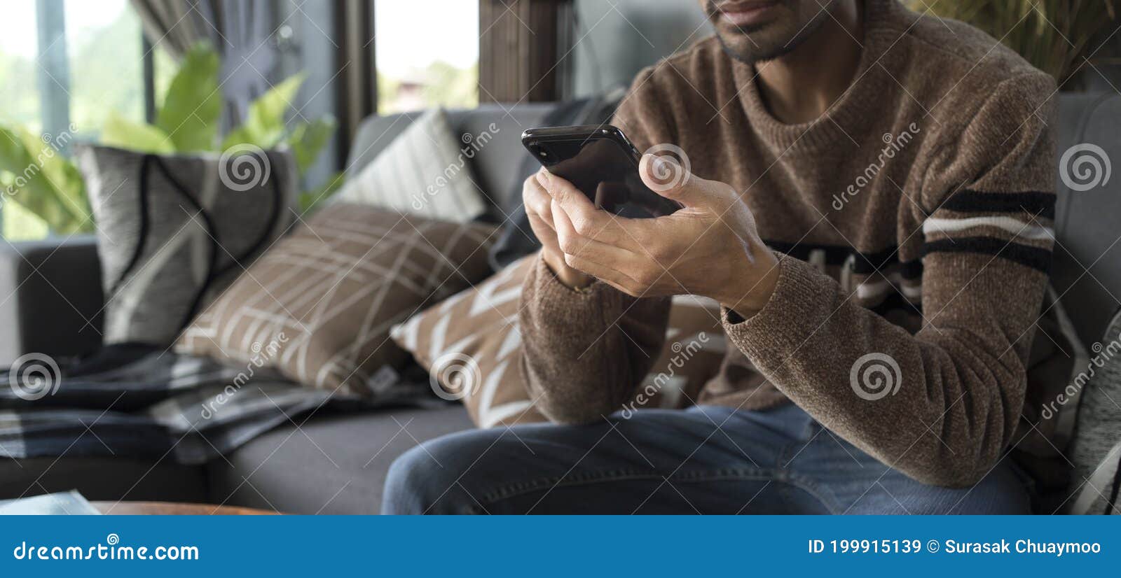 Young Man Using Smartphone with Application during Stay at Home Stock ...