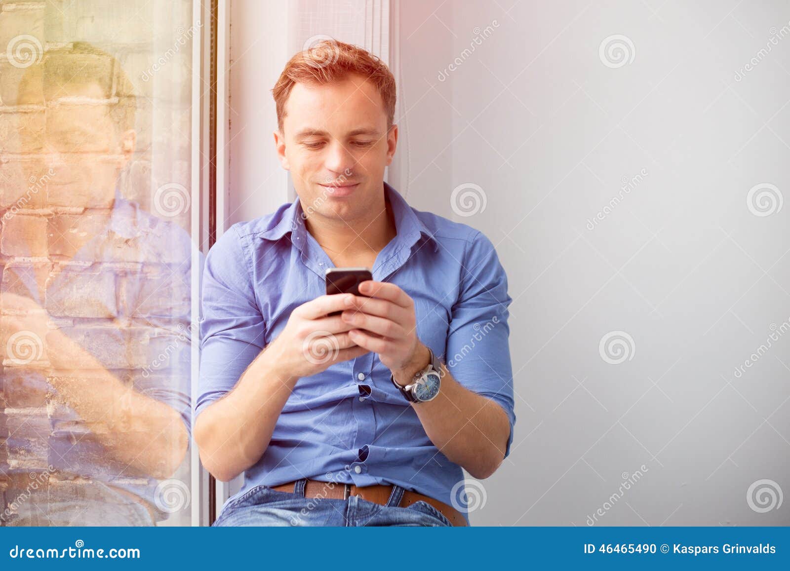 Young man using smartphone stock photo. Image of communication - 46465490