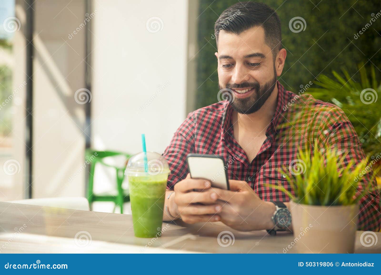 Young Man Using a Smartphone Stock Photo - Image of latin, cell: 50319806