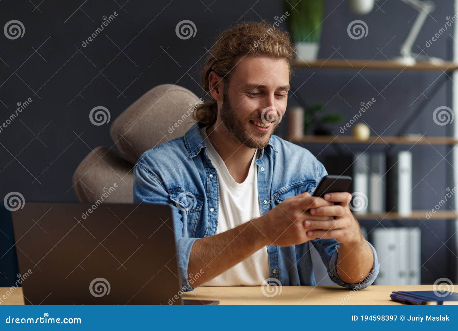 Young Man Using Smartphone and Smiling. Happy Businessman Using Mobile ...