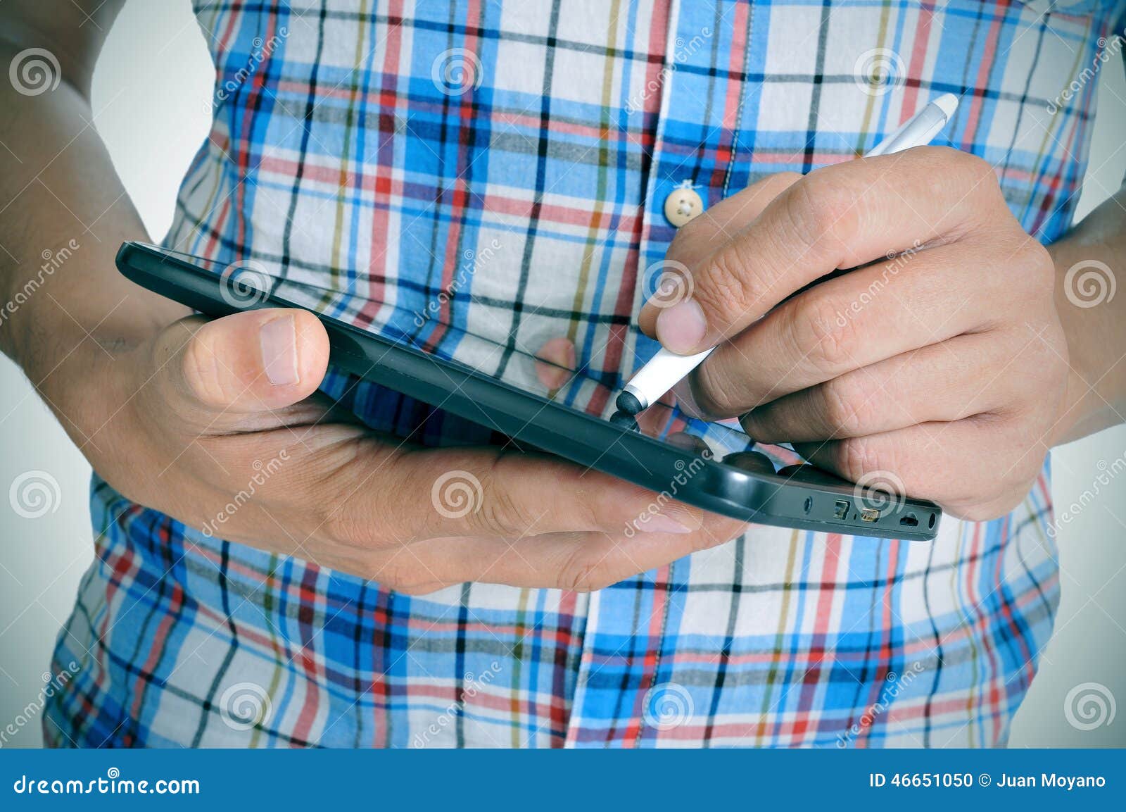 Young Man Using a Stylus Pen in His Tablet Stock Photo - Image of ...