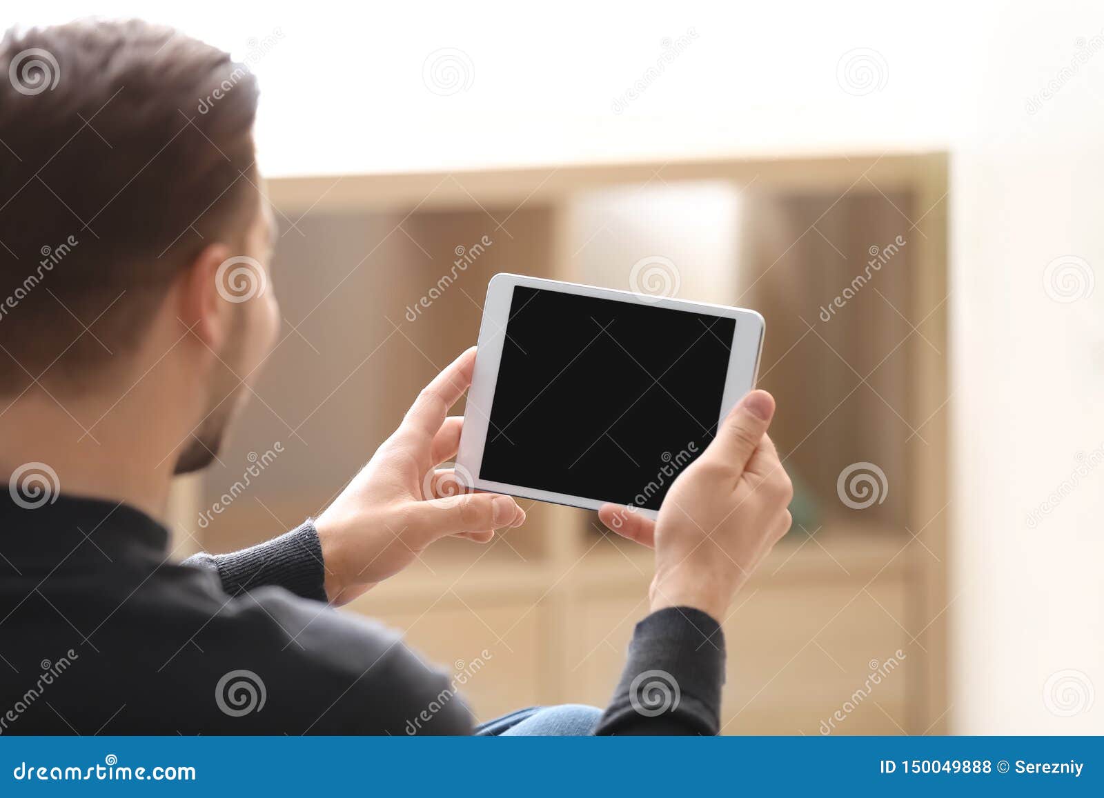 Young Man Using Tablet at Home Stock Photo - Image of modern, mobile ... Young Man Using Tablet at Home Stock Photo - Image of modern, mobile ...