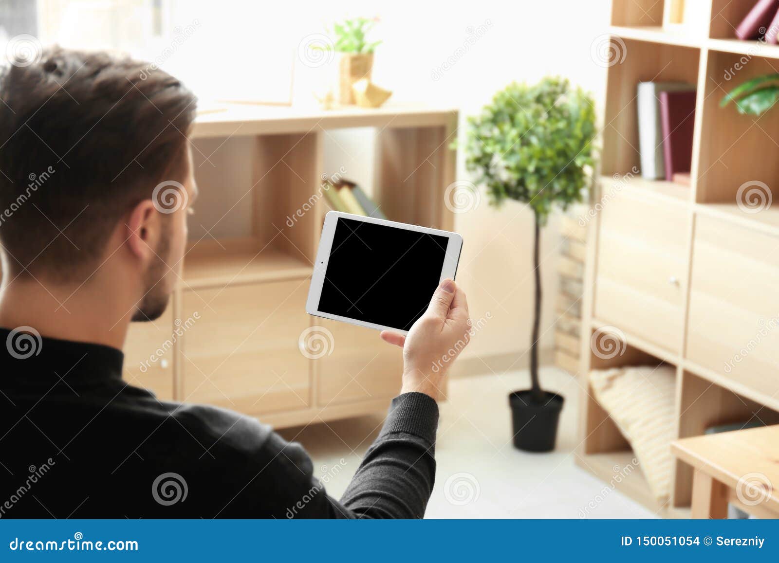Young Man Using Tablet at Home Stock Photo - Image of media ... Young Man Using Tablet at Home Stock Photo - Image of media ...