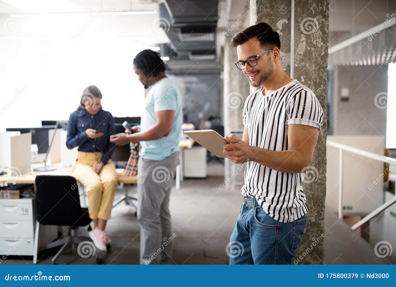 Young Man Using Technology, Digital Tablet in Corporate Business Office ...
