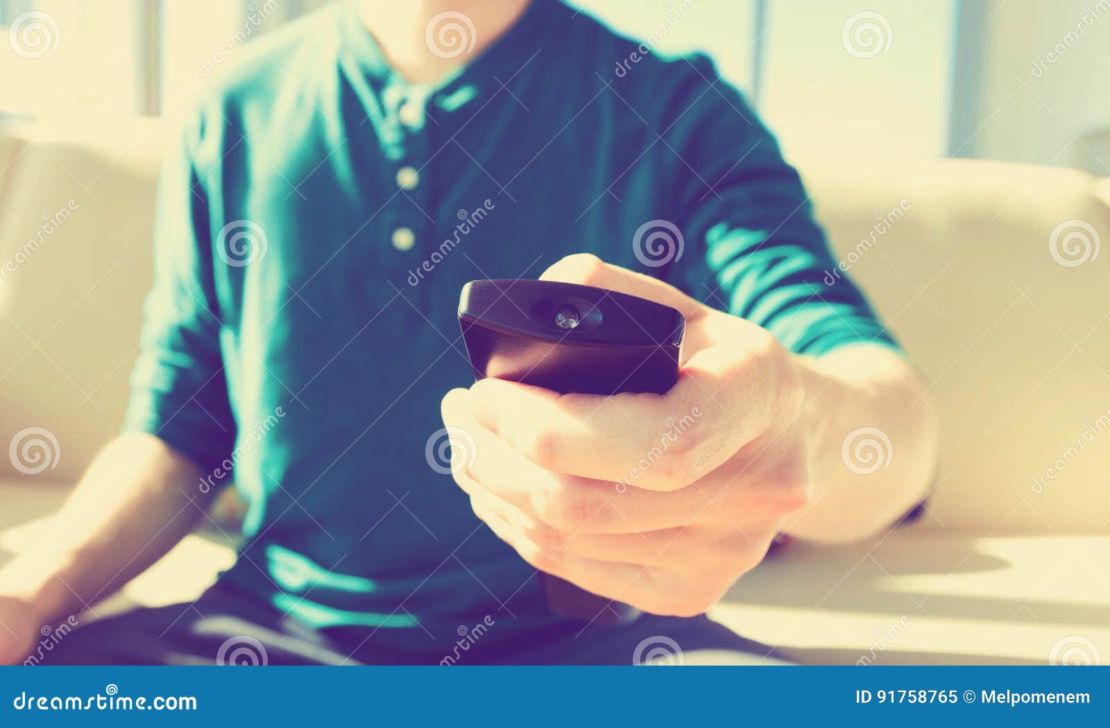 Young Man Using TV Remote Control Stock Image - Image of couch, modern ...