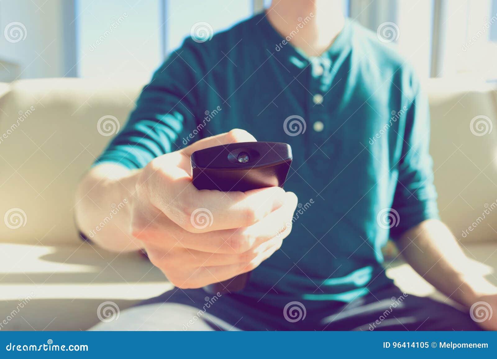 Young Man Using TV Remote Control Stock Image - Image of background ...