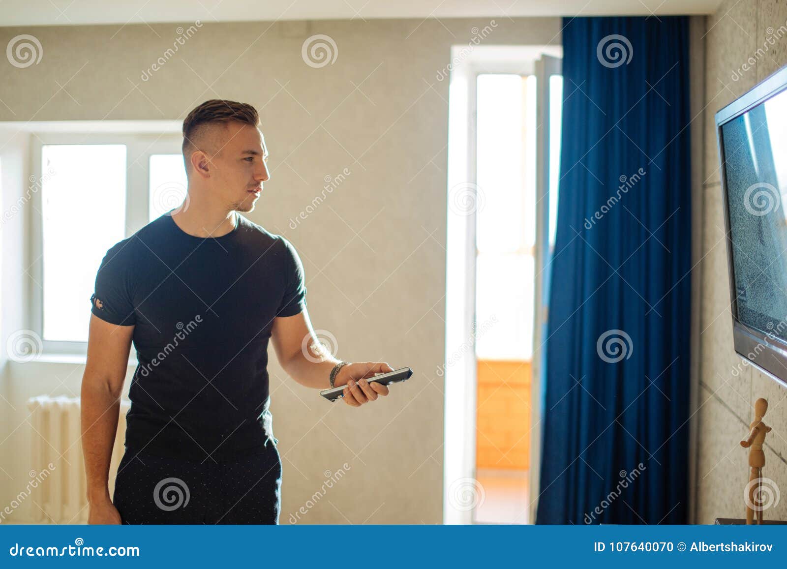 Man Using Tv Remote Control in Living Room at Home Stock Photo - Image ...