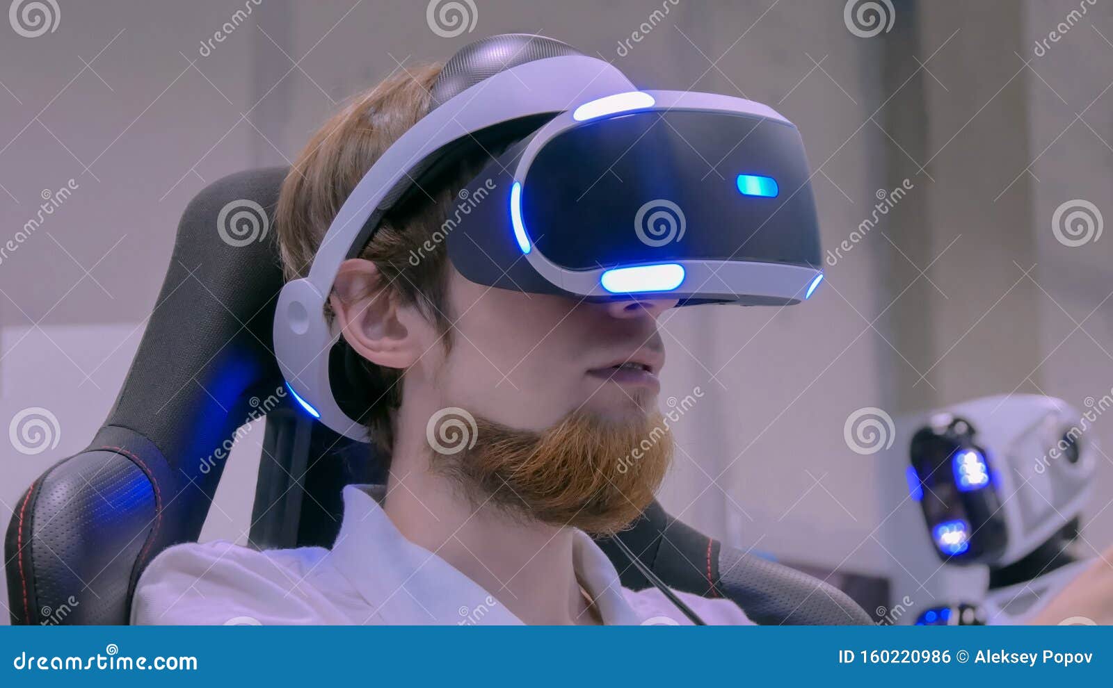 Young Man Using Virtual Reality Headset Stock Photo - Image of activity ...