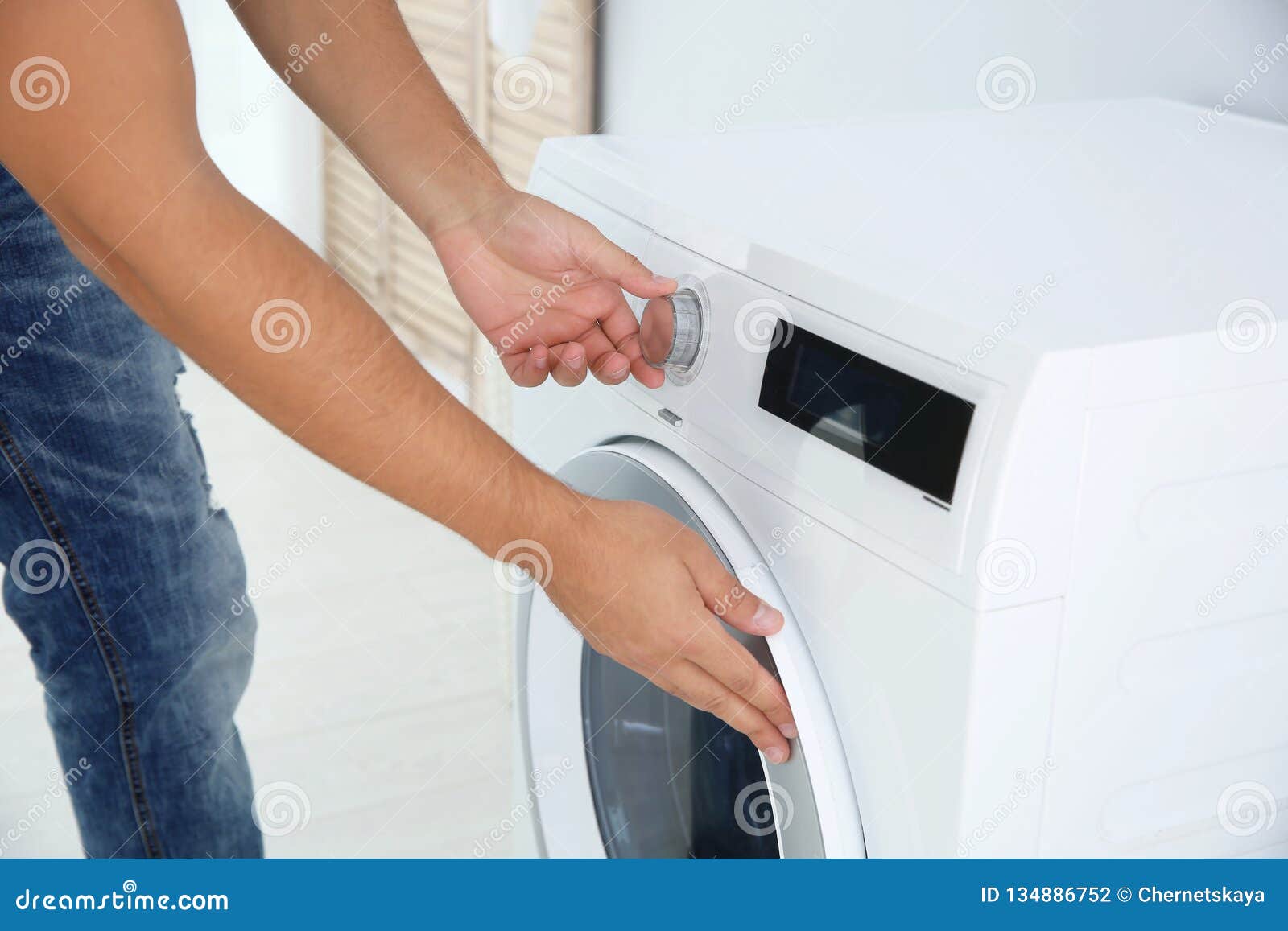 Young Man Using Washing Machine, Closeup. Stock Photo - Image of chore ...