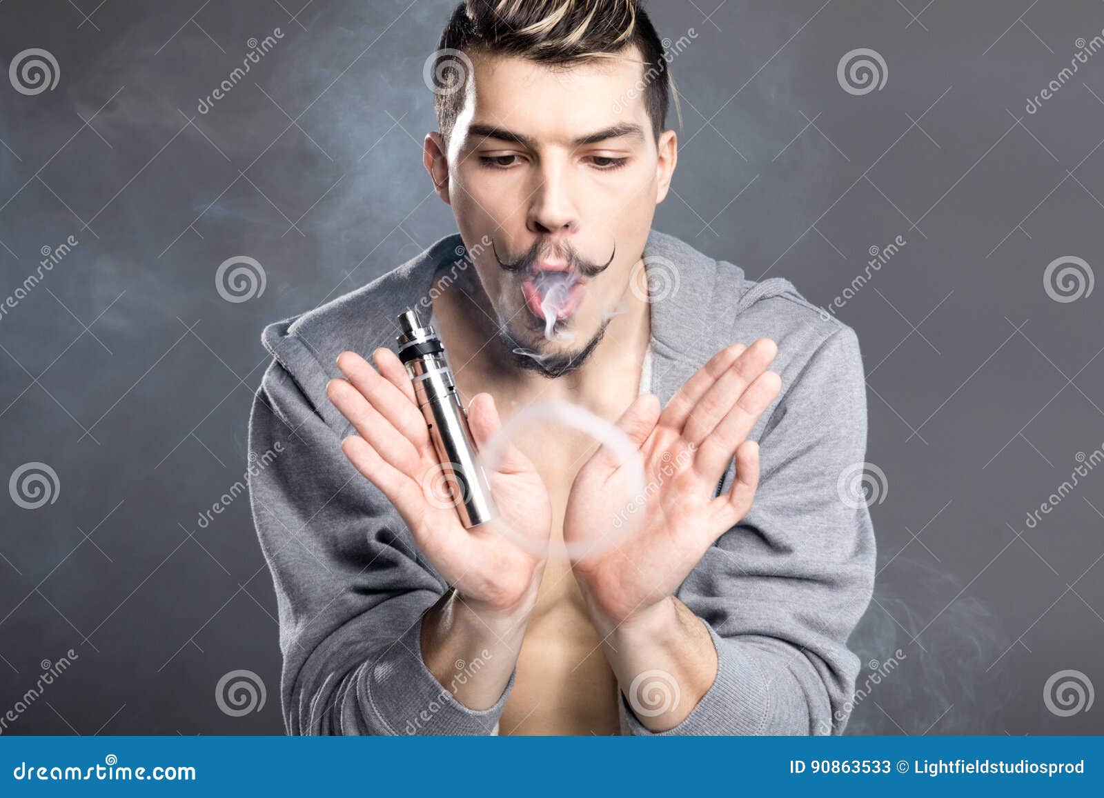 Young man vaping stock image. Image of alone, concentrated - 90863533