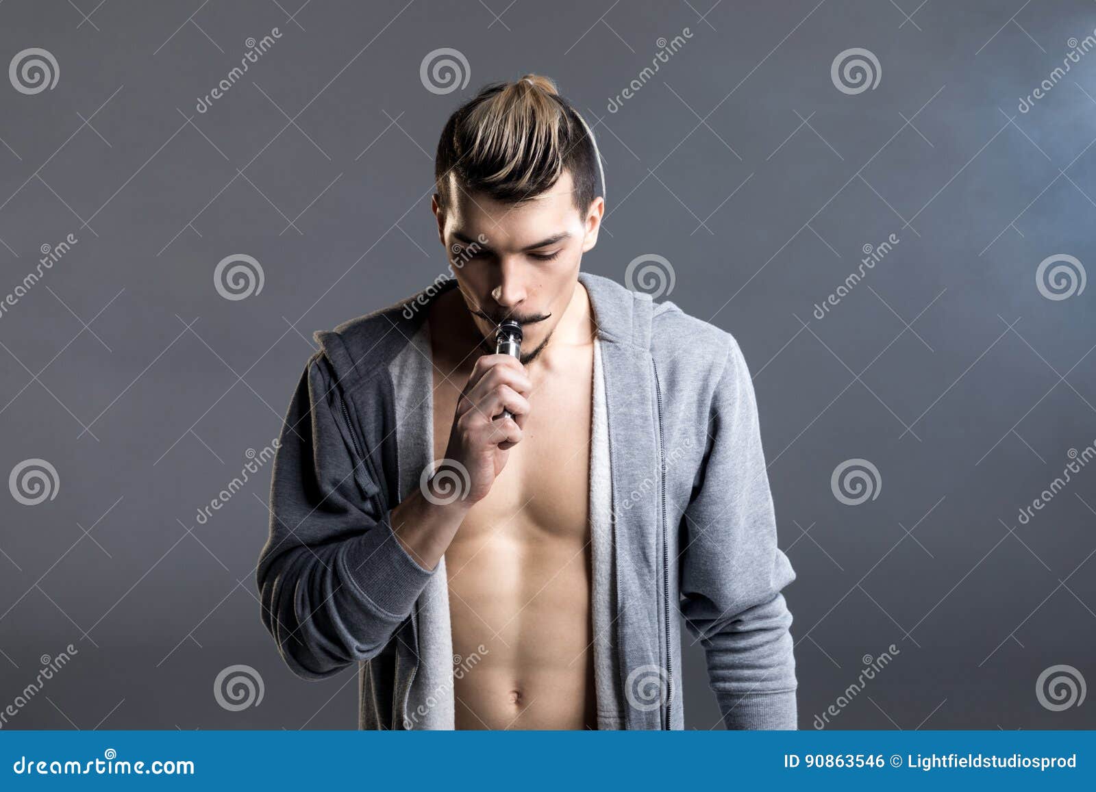 Young man vaping stock photo. Image of concentrated, caucasian - 90863546