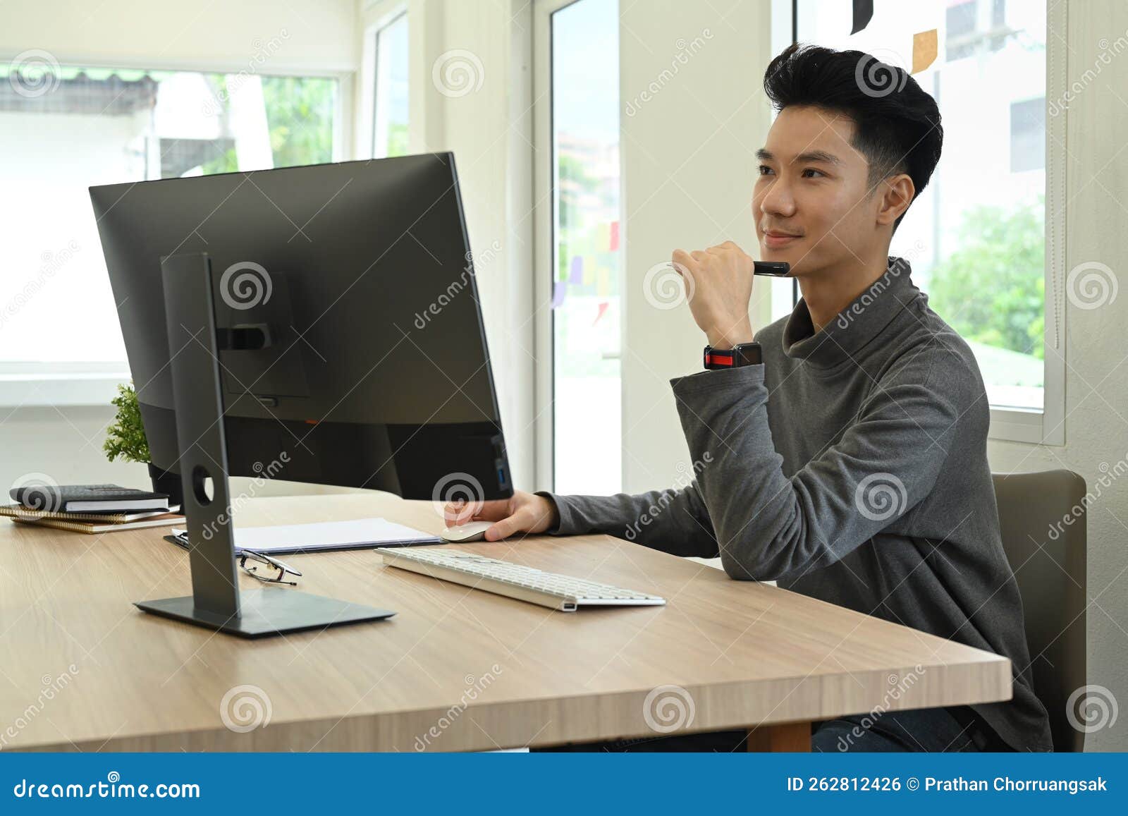 Young Man Video Editor Working with Footage and Post Production Montage ...