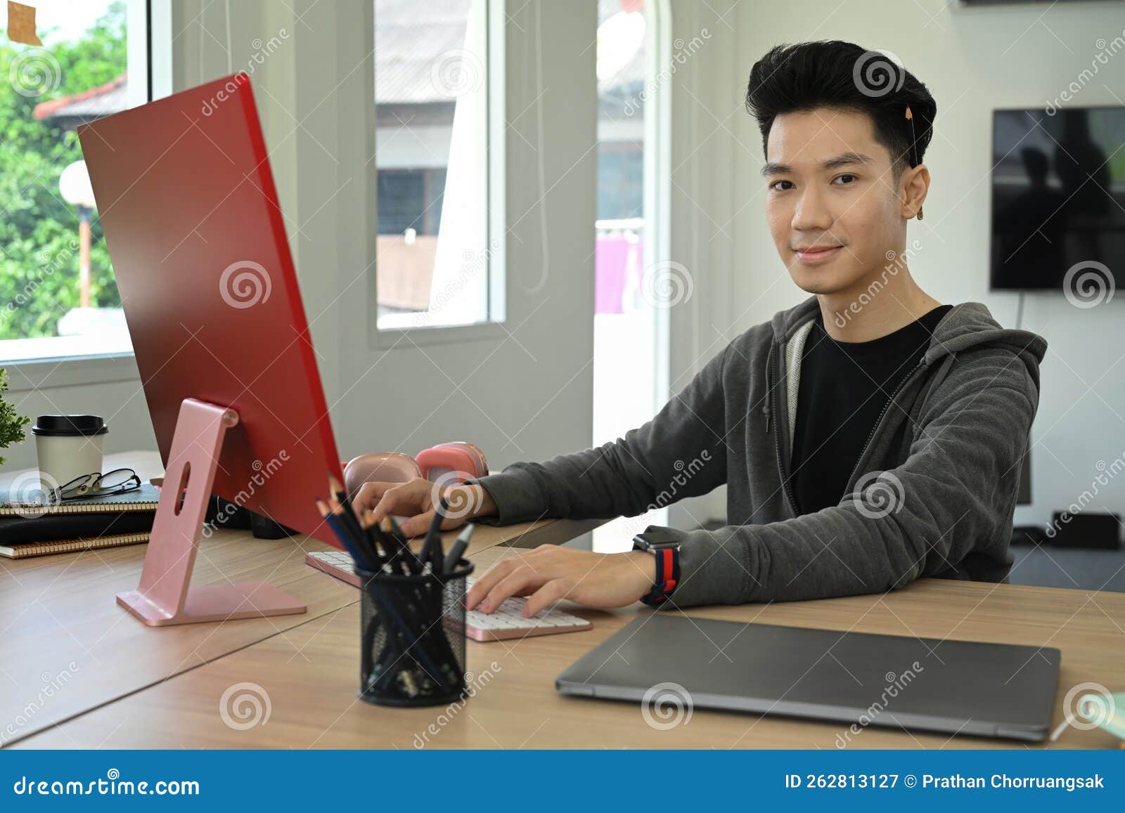 Young Man Video Editor Working with Footage and Post Production Montage ...