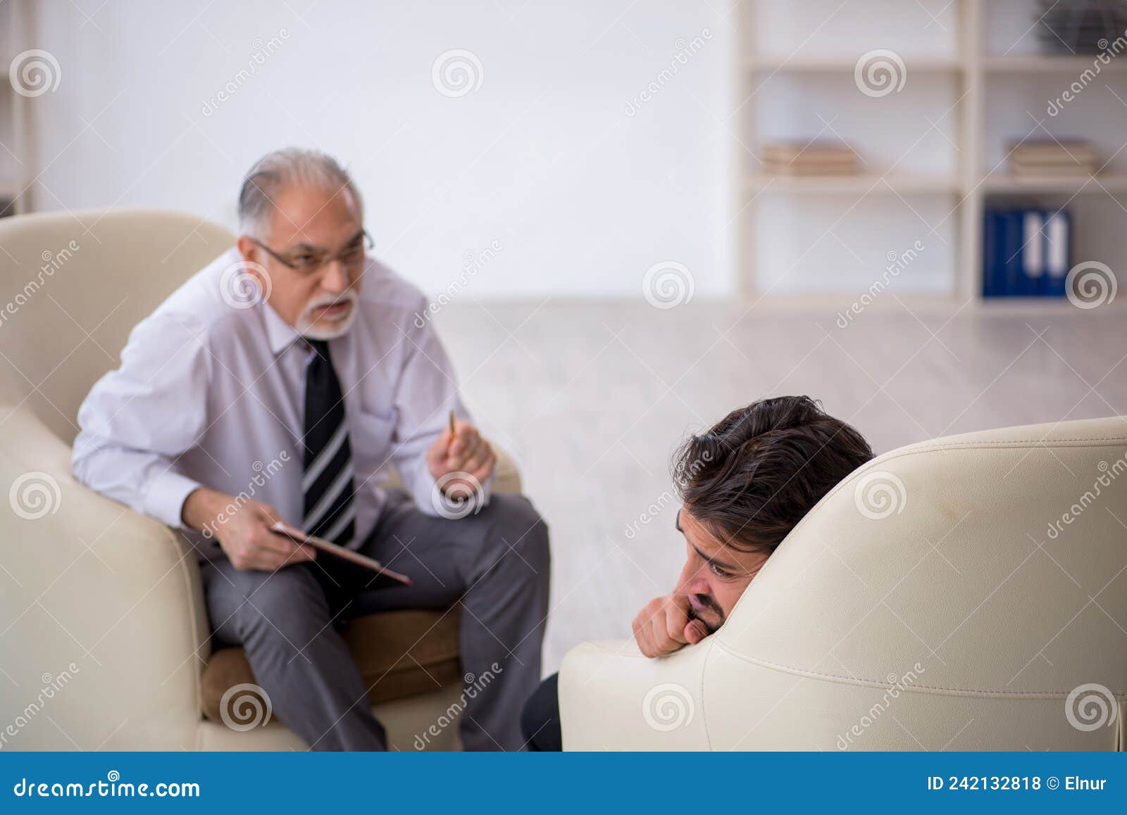 Young Man Visiting Old Psychologist Stock Photo - Image of therapist ...
