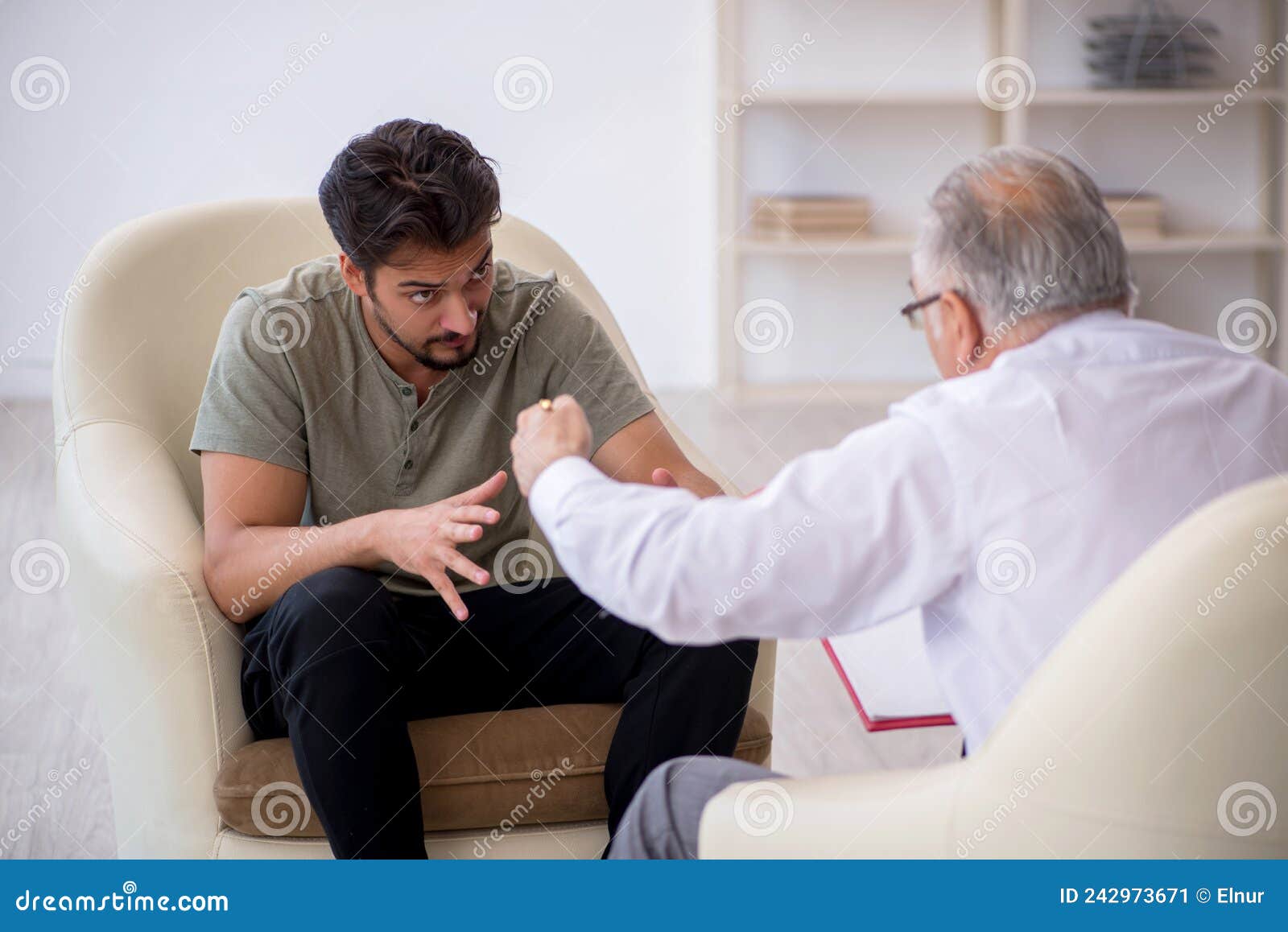 Young Man Visiting Old Psychologist Stock Image - Image of listening ...