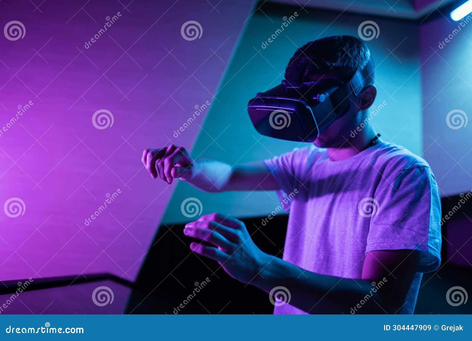 Man with a VR Headset Making Various Hand Movements in the Air Stock ...