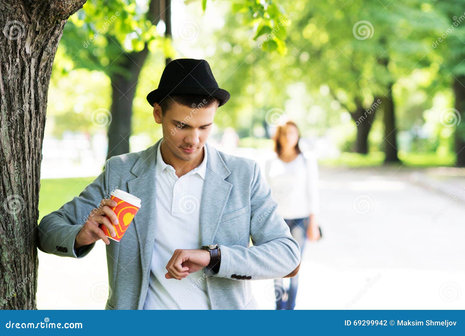 Young Man Waiting for His Love in the Park Checking the Watch Stock ...