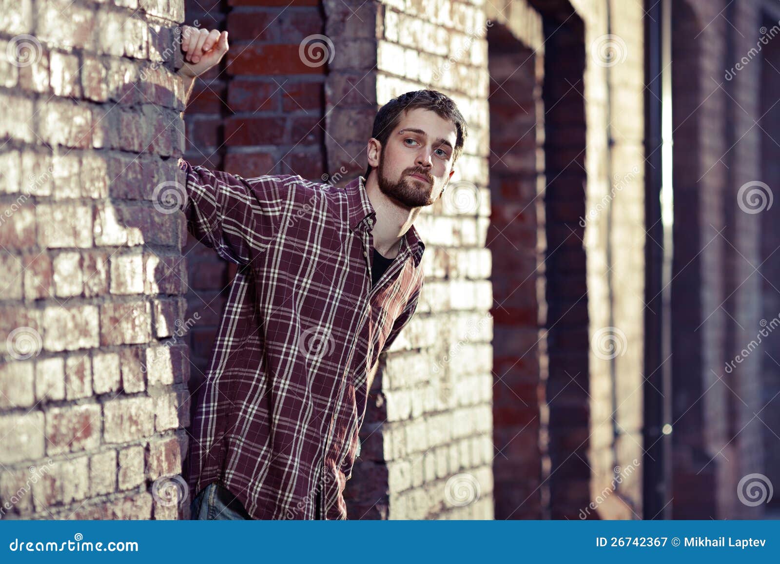 Young Man Waiting for Someone Stock Image - Image of male, brick: 26742367