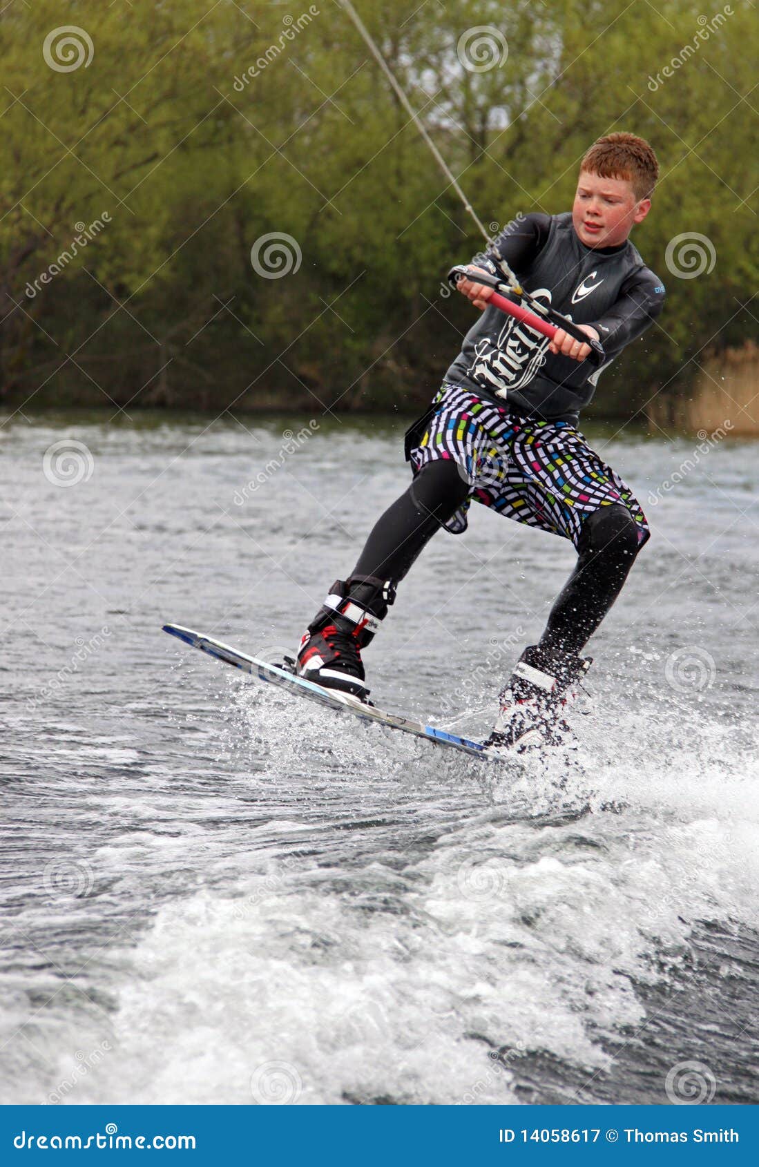 A young man wake-boarding editorial photography. Image of wakeboarder ...