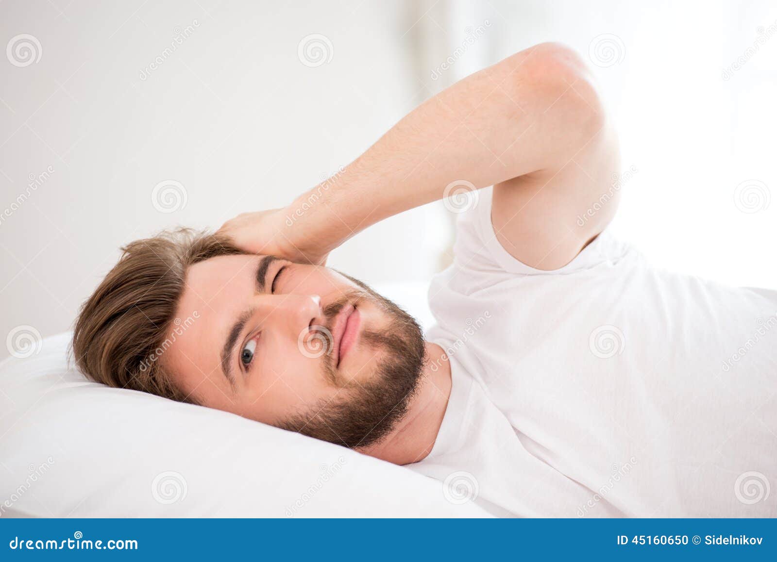 Young man waking up stock photo. Image of bright, beauty - 45160650