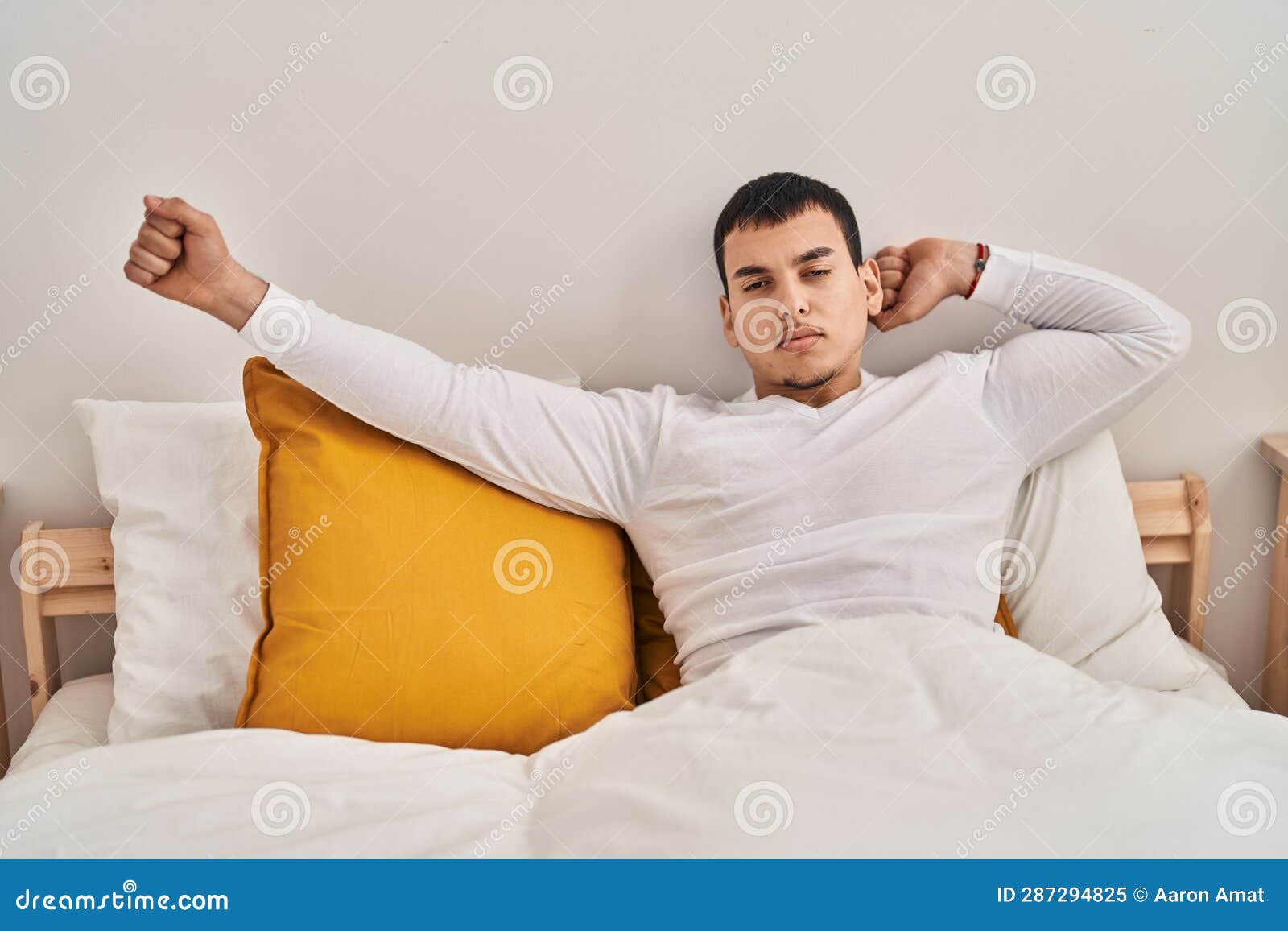 Young Man Waking Up Stretching Arms at Bedroom Stock Image - Image of ...