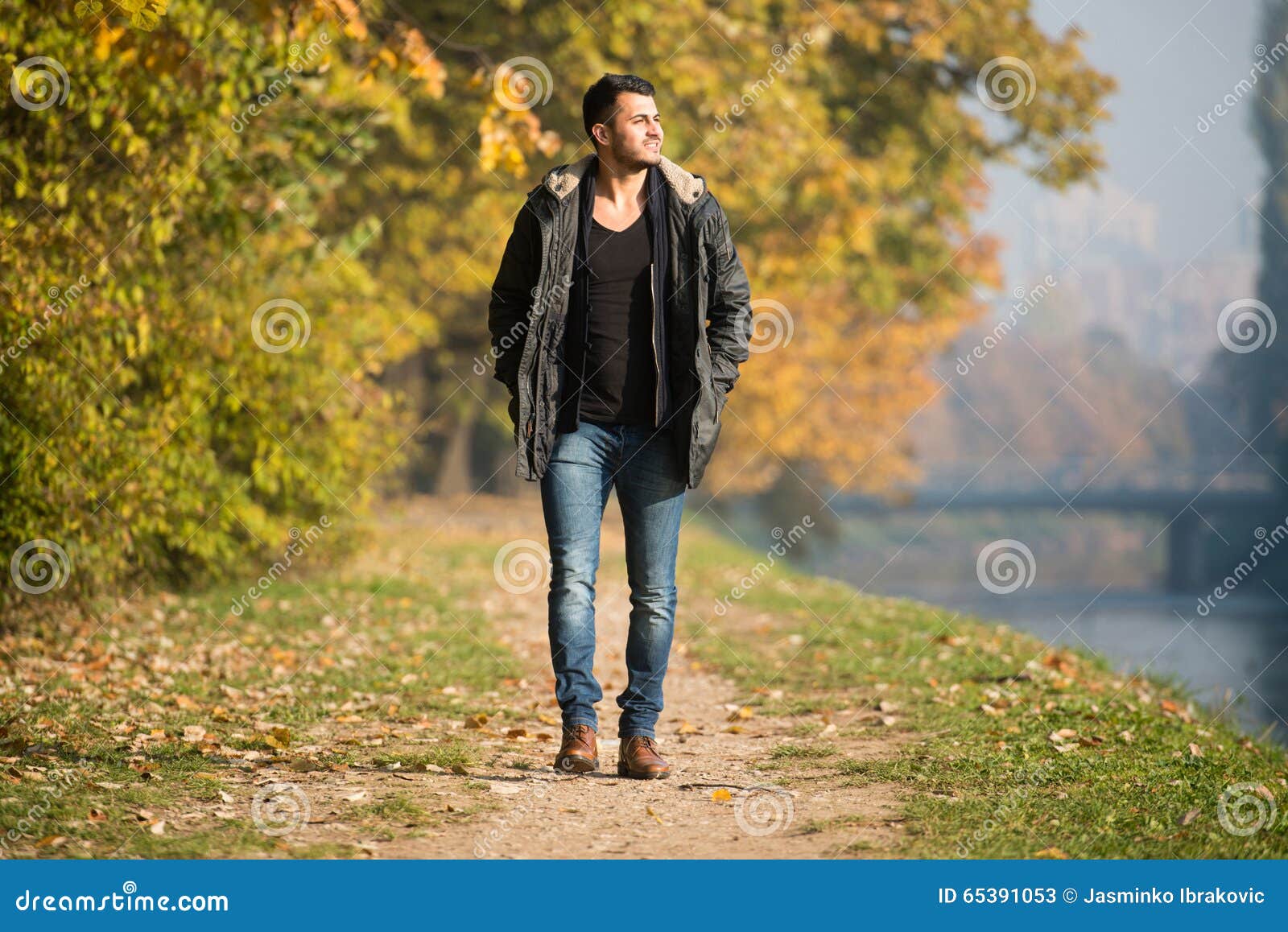 Young Man Walking in Autumn Forest Stock Image - Image of colorful ...