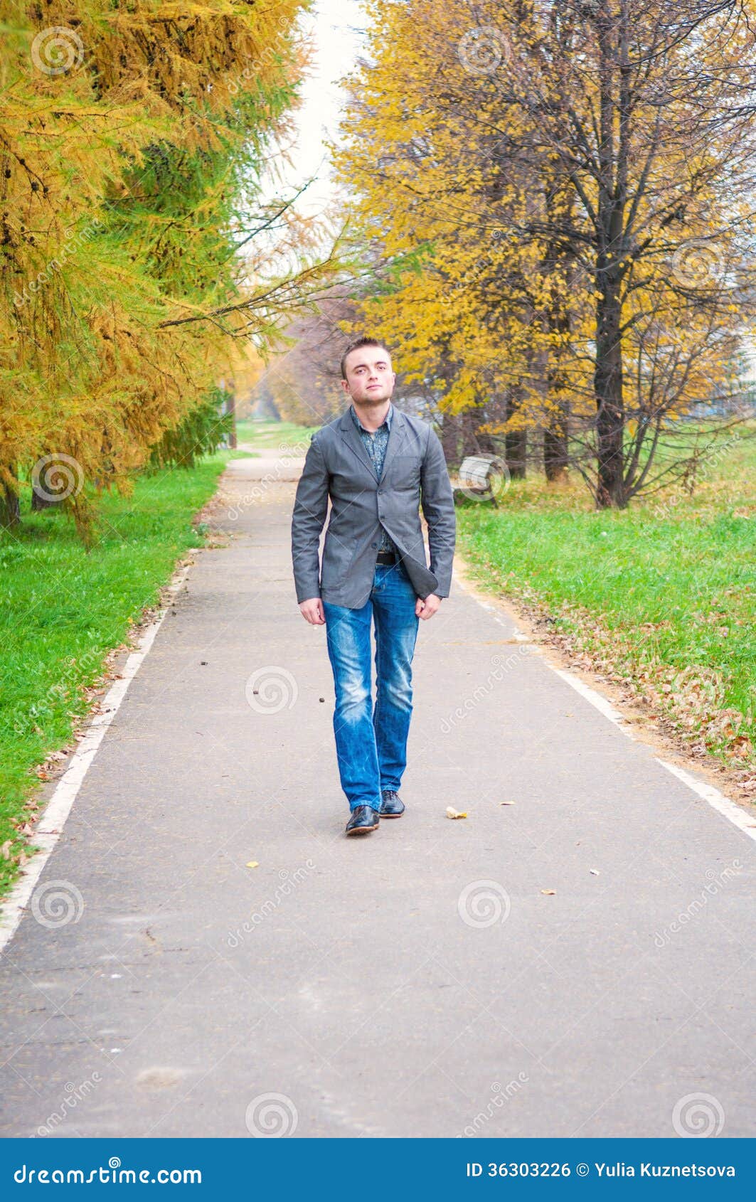 Young Man Walking in Autumn Park Stock Photo - Image of fashion ...