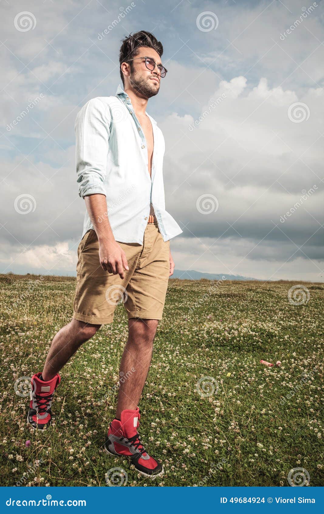 Young man walking outside stock photo. Image of male - 49684924