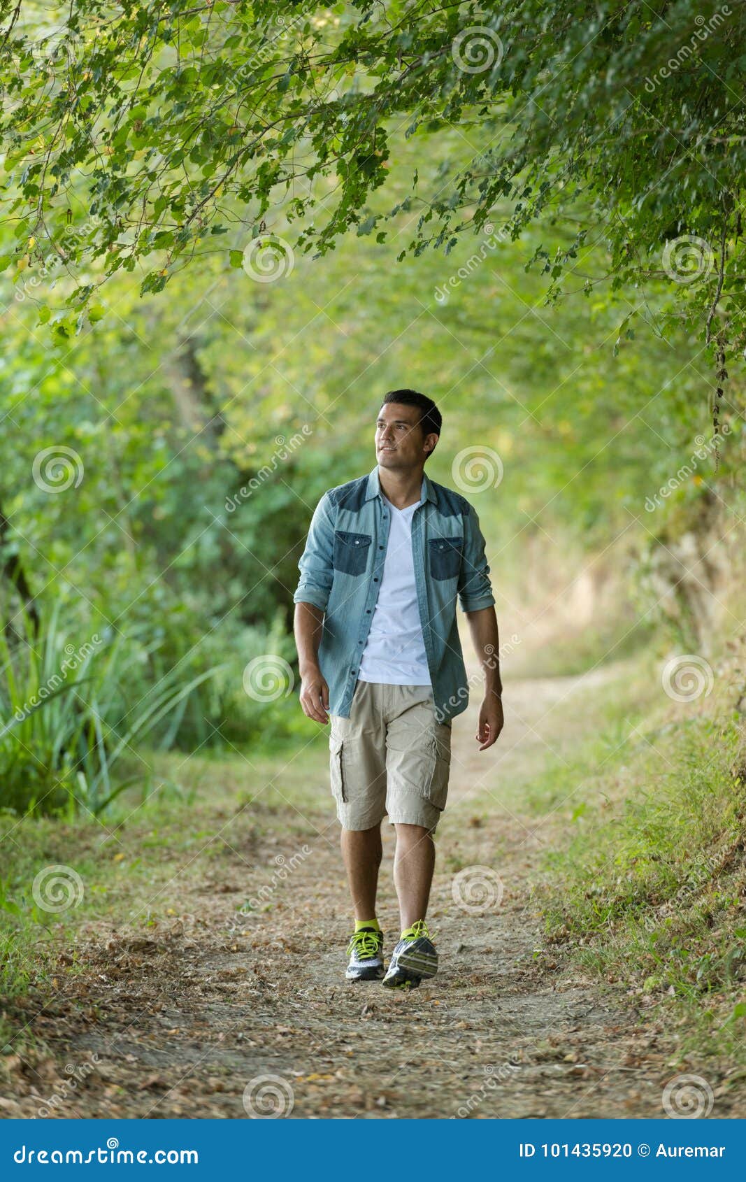 Young man walking in park stock photo. Image of looking - 101435920