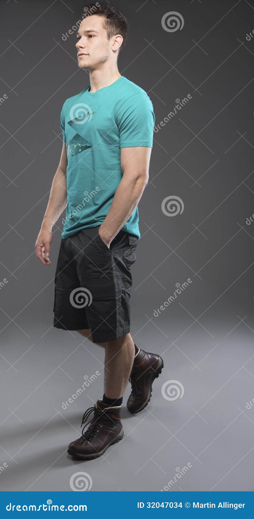 Young Man Walking in Shorts Stock Photo - Image of fashionable, male ...