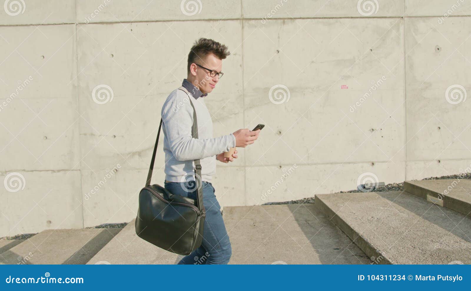 A Young Man Using a Phone Outside Stock Photo - Image of communication ...