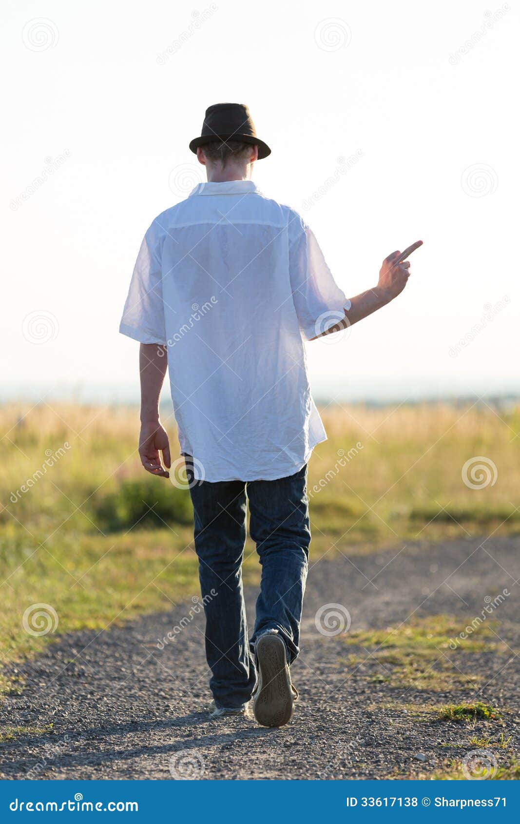 Young man walking stock photo. Image of land, lonely - 33617138