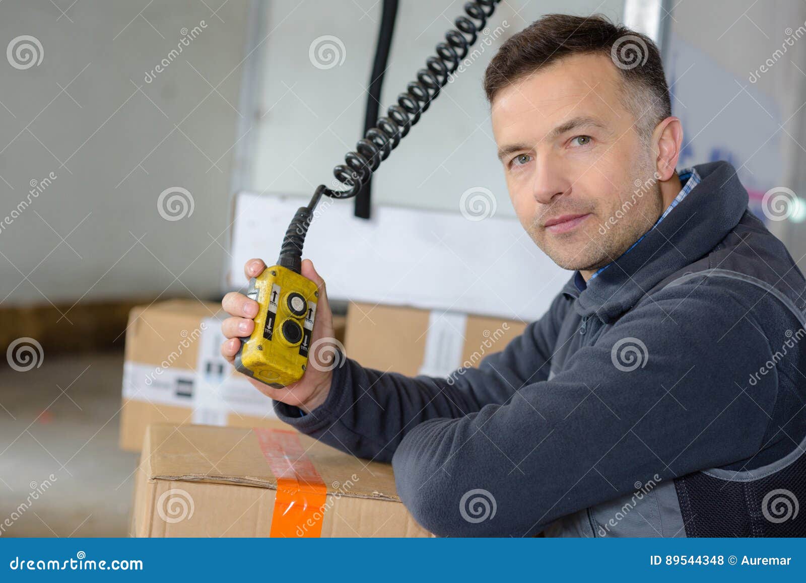 Young man in warehouse stock photo. Image of male, labour - 89544348